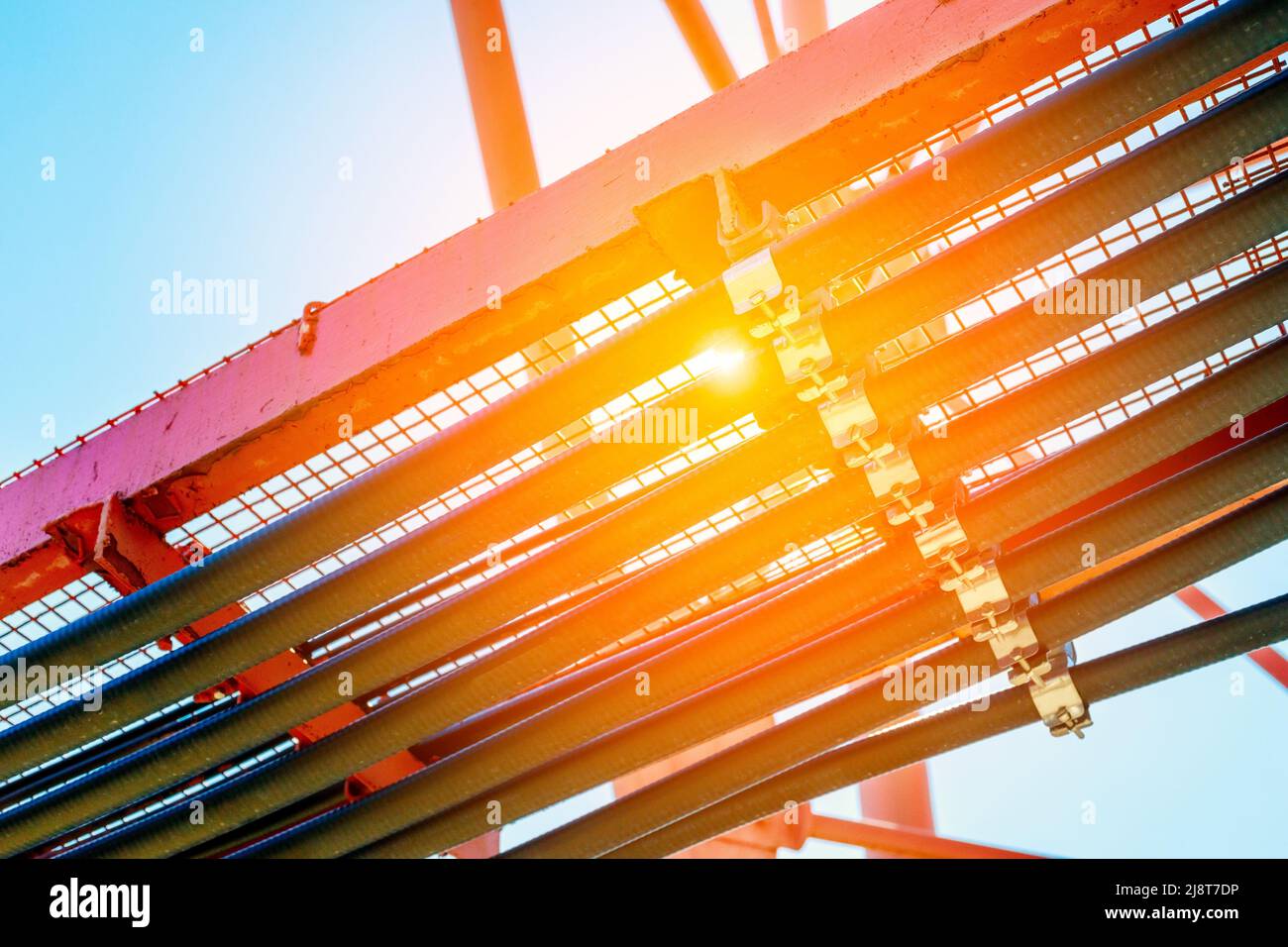 Black power cable under electrical voltage is fixed on metal junction ...