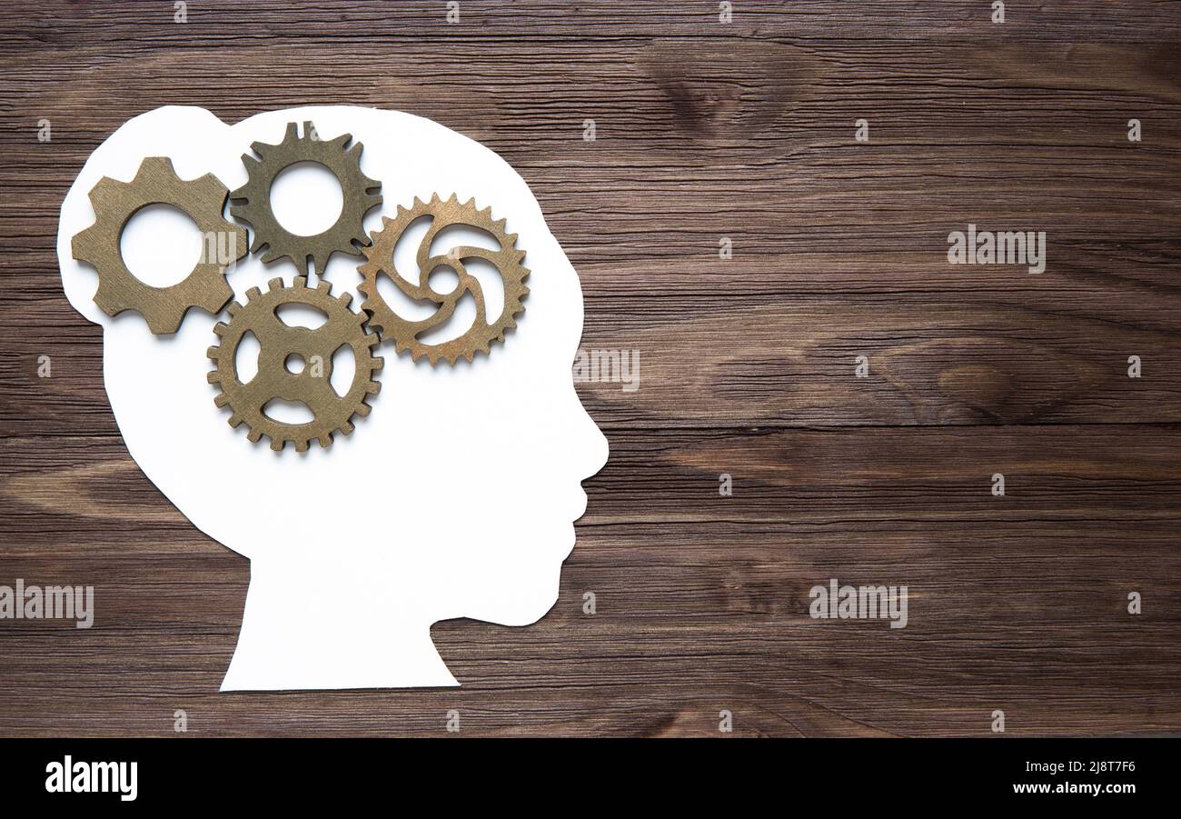 Female head profile paper cutout with gears inside. Thinking process ...
