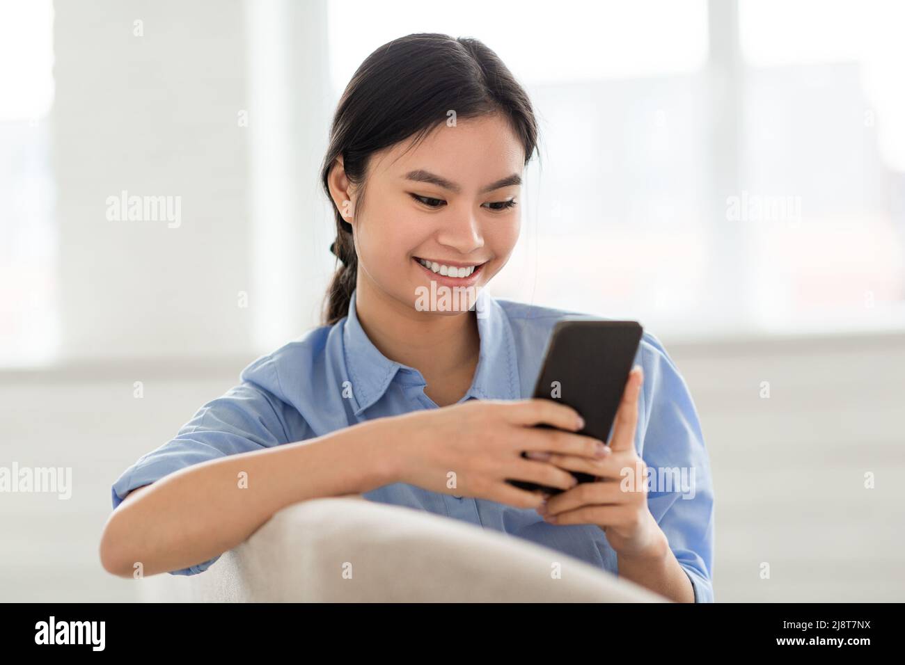 Closeup woman scrolling smartphone hi-res stock photography and images ...