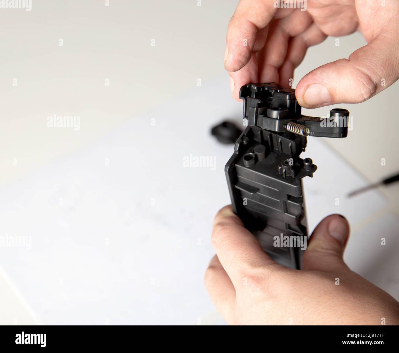 Disassembly of a drum cartridge on a white background. Cleaning and ...