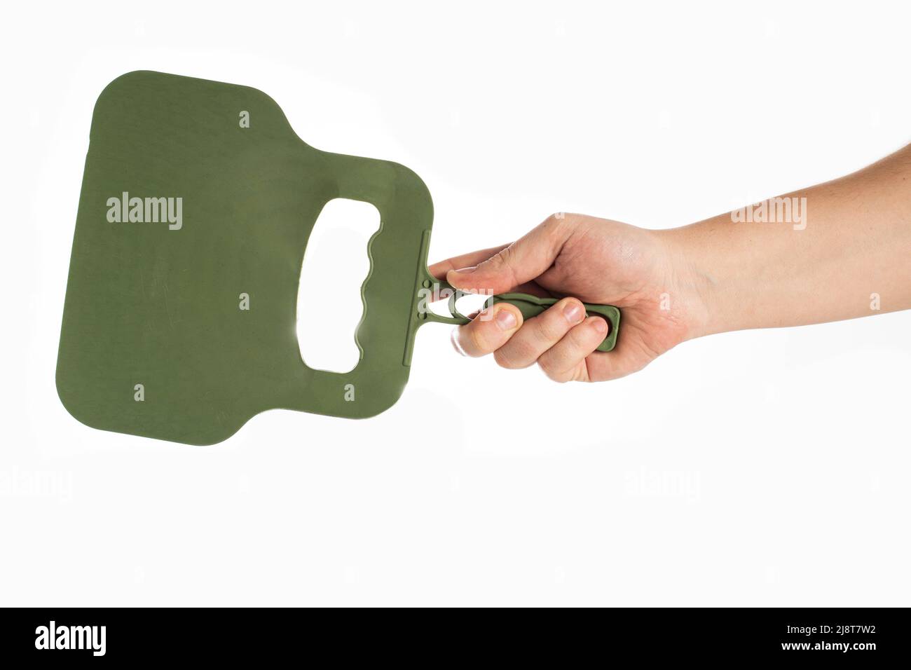 Green fan in hand on a white background to fan the fire Stock Photo - Alamy
