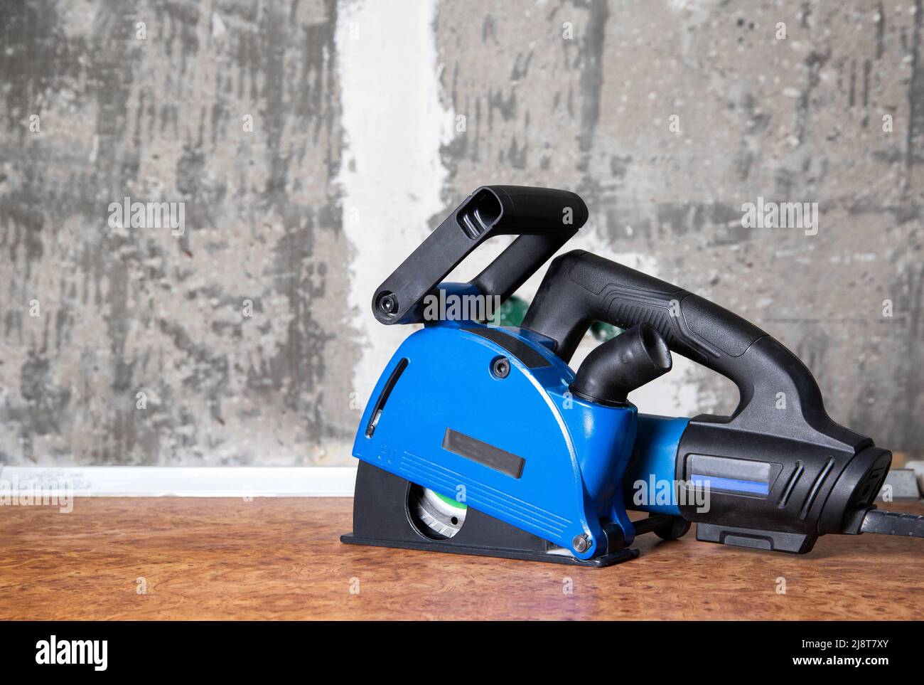 Modern electric powerful wall chaser with diamond discs on the ...