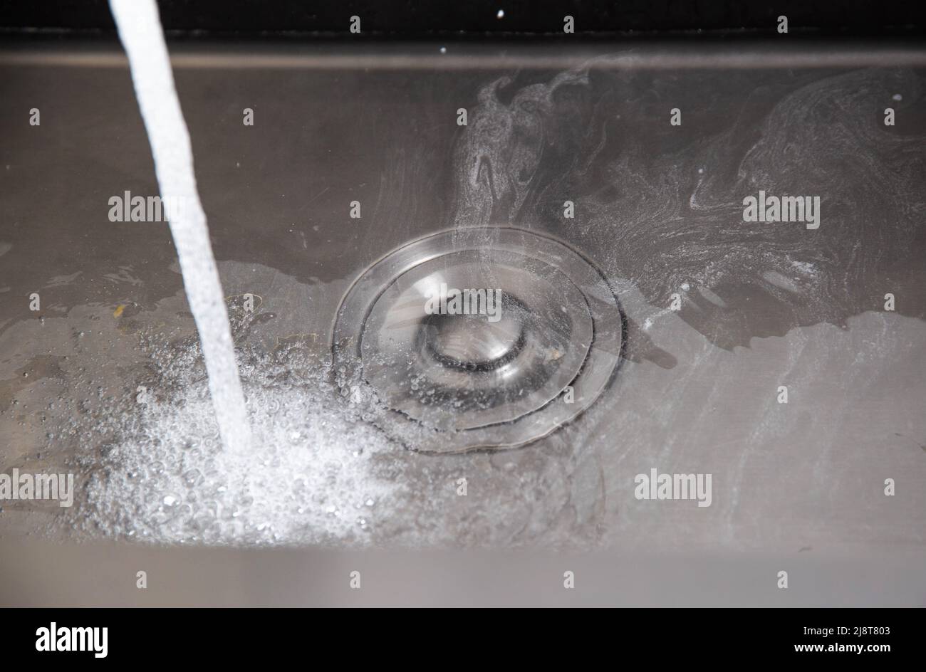 Modern stainless steel sink with plug for draining water and filling ...