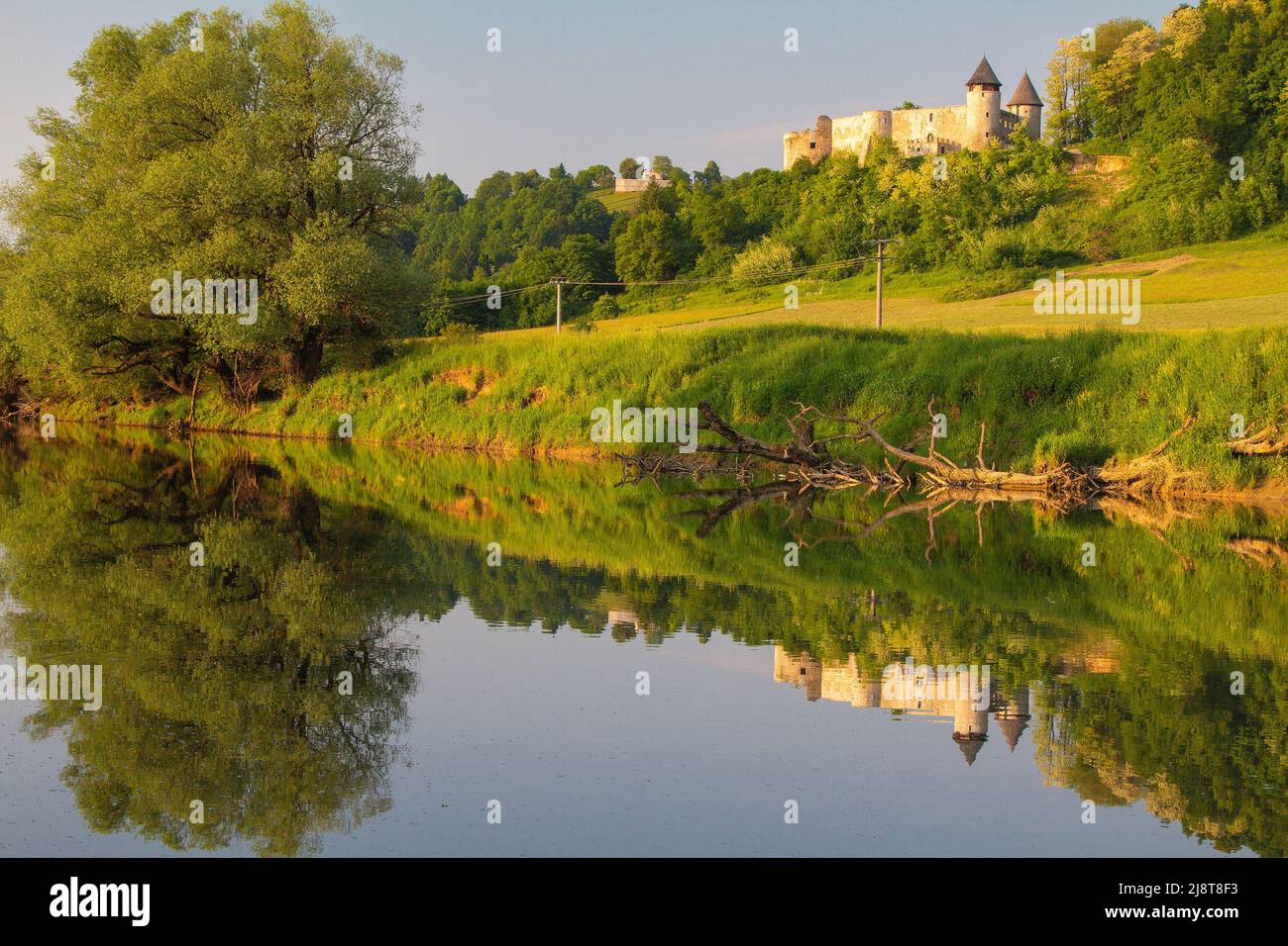 The reflection of Novigrad na Dobri fortress on the Dobra River ...