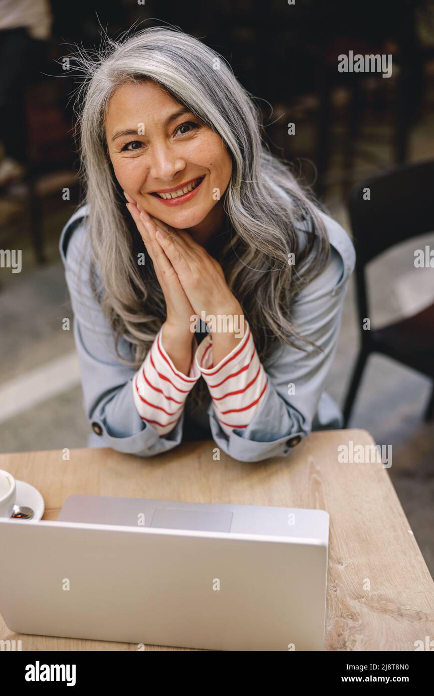 Confident female with happy face posing outdoors Stock Photo - Alamy