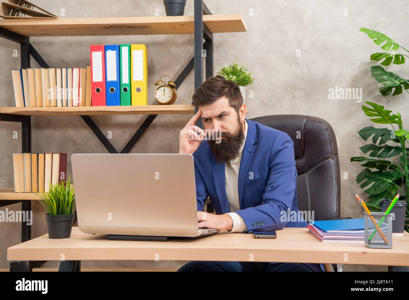 Running a project. Business manager. Thoughtful manager at work ...