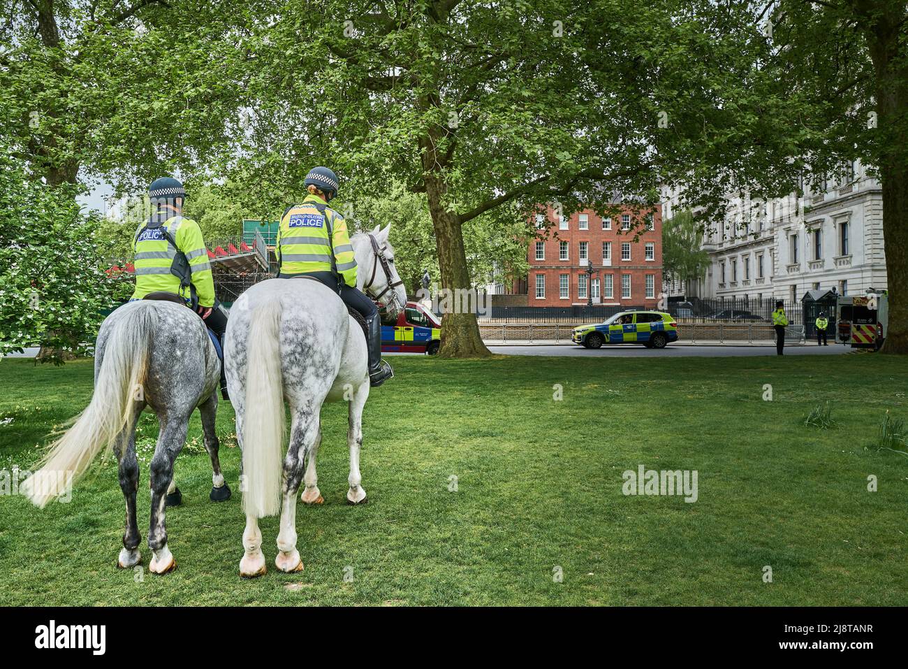 Two mounted metropolitan police officers in St James's park, outside 10 ...