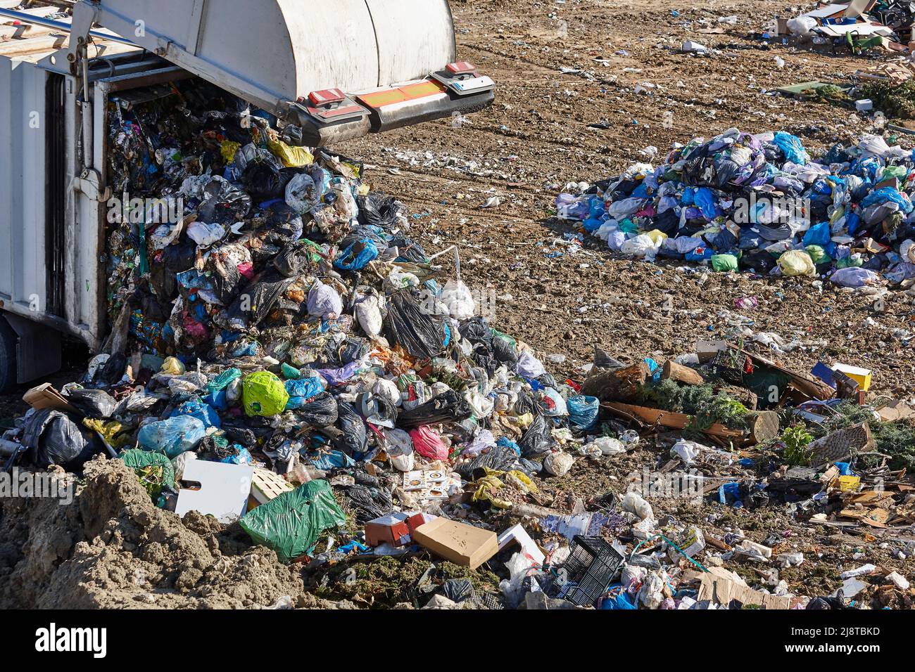 Truck unloading garbage on an open air dump. Waste recycling Stock ...