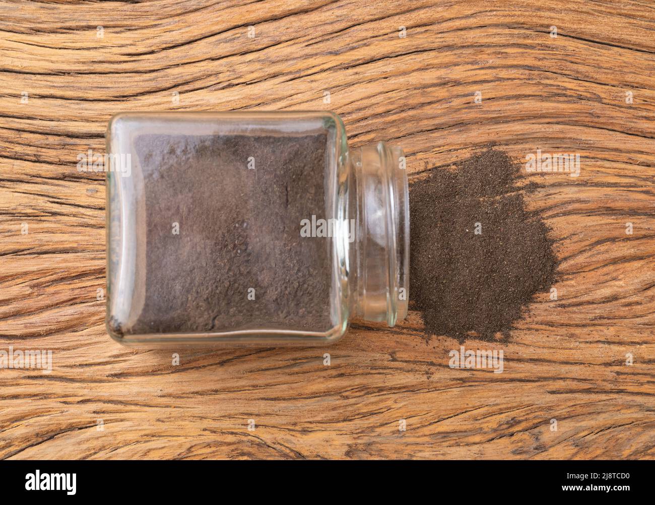 Top view, closeup of ground black pepper on a glass pot Stock Photo - Alamy
