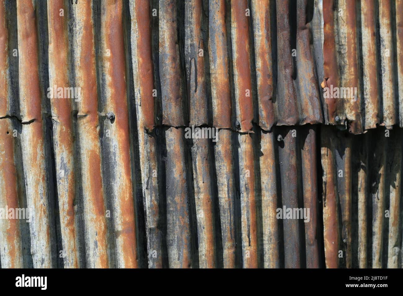 Rusty corrugated steel sheets joined together Stock Photo - Alamy