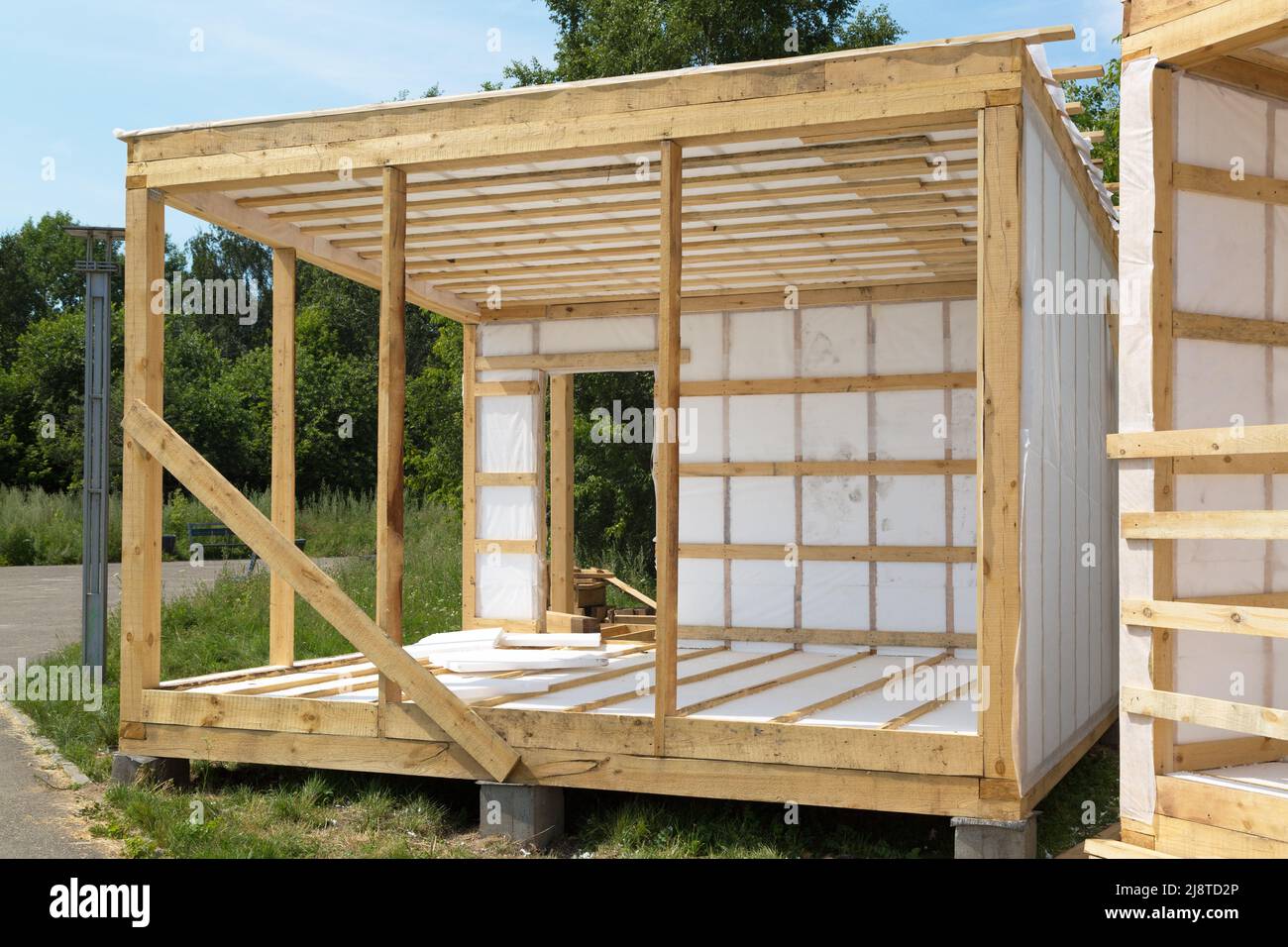 Wooden log house, a structure insulated with thin foam in the open air ...