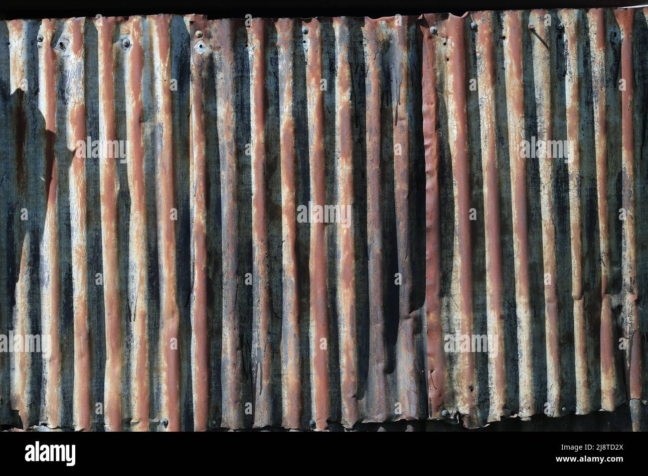 Rusty corrugated steel sheets with a shadow Stock Photo - Alamy