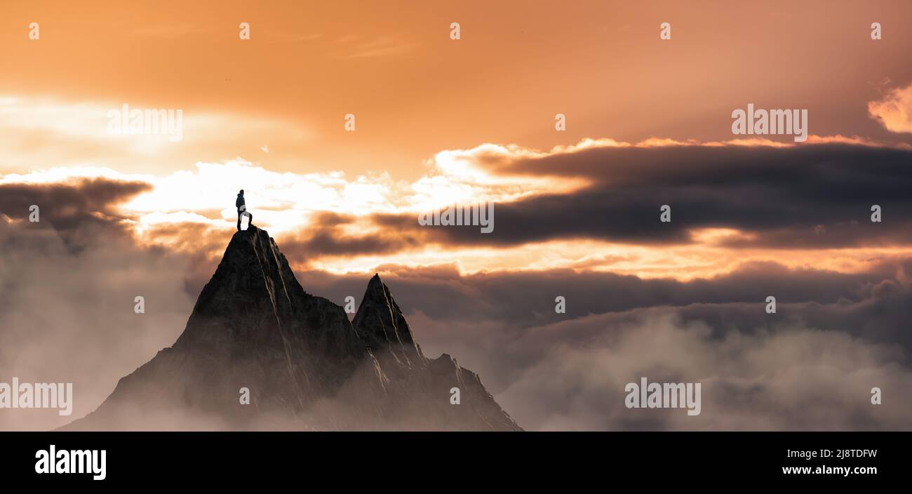Adventurous Man Hiker Standing on top of a rocky mountain Stock Photo ...