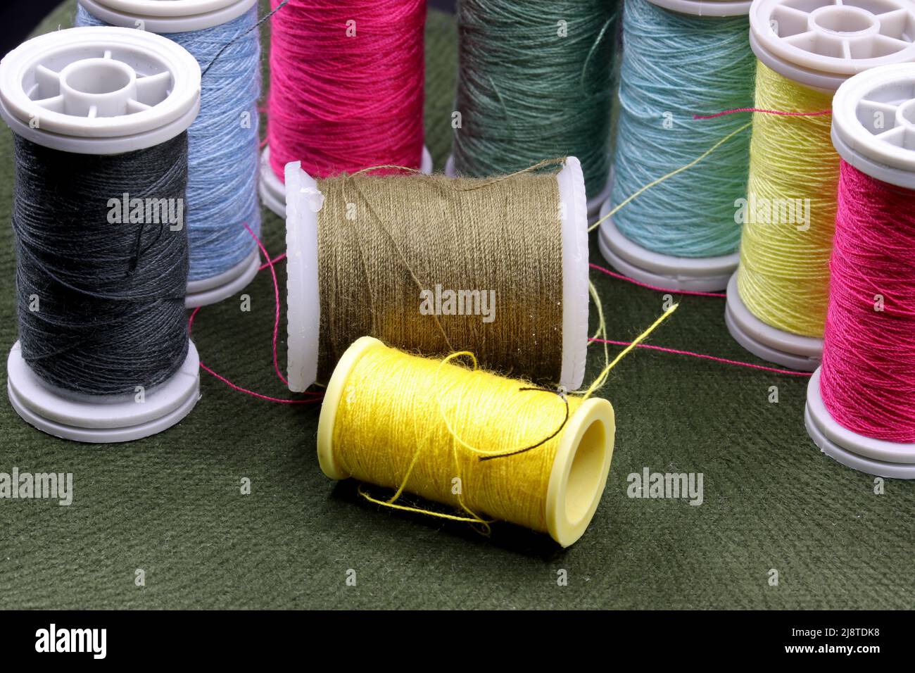 Sewing accessories on fabric backdrop Stock Photo - Alamy