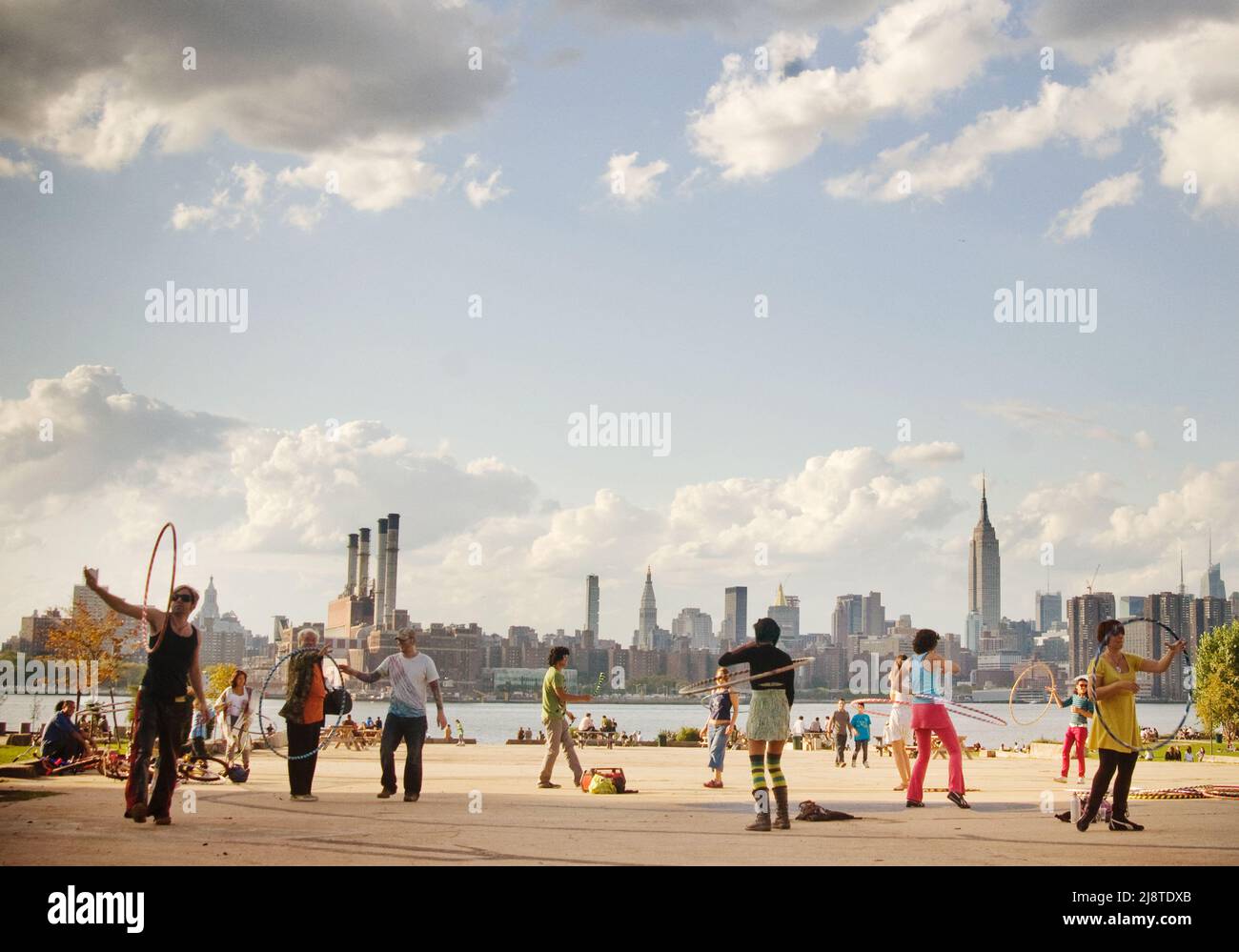 group of people Hula Hooping in the East River park, Williamsburg ...