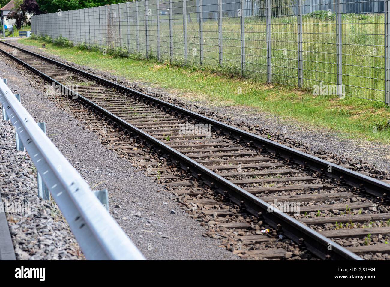 Railroad tracks lying on wooden sleepers, the tracks are arranged along ...