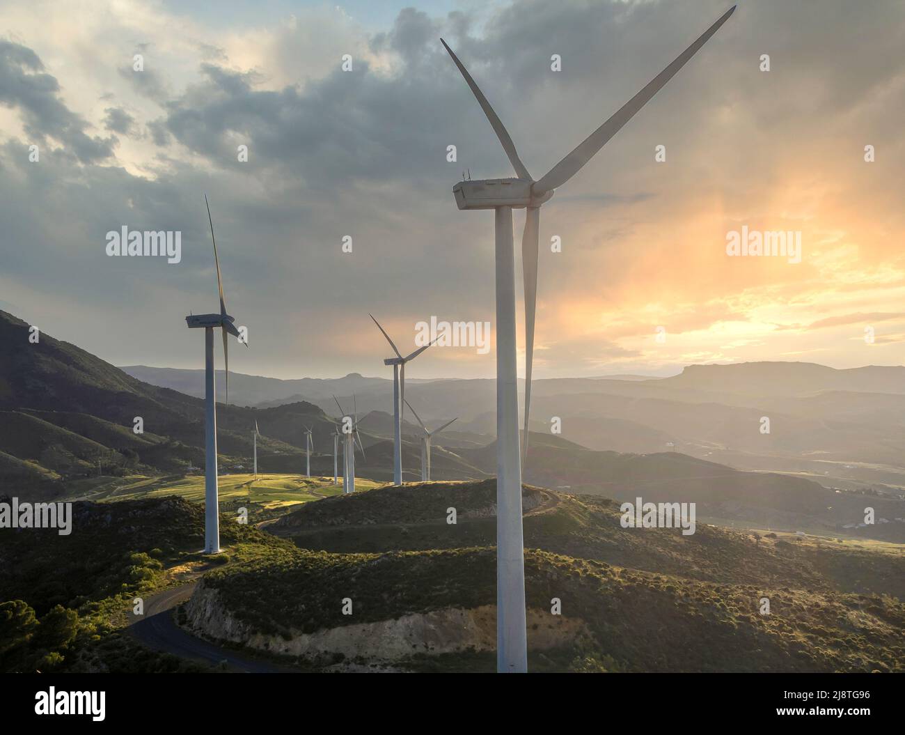Beautiful wind turbine in the countryside in the time of sunset ...