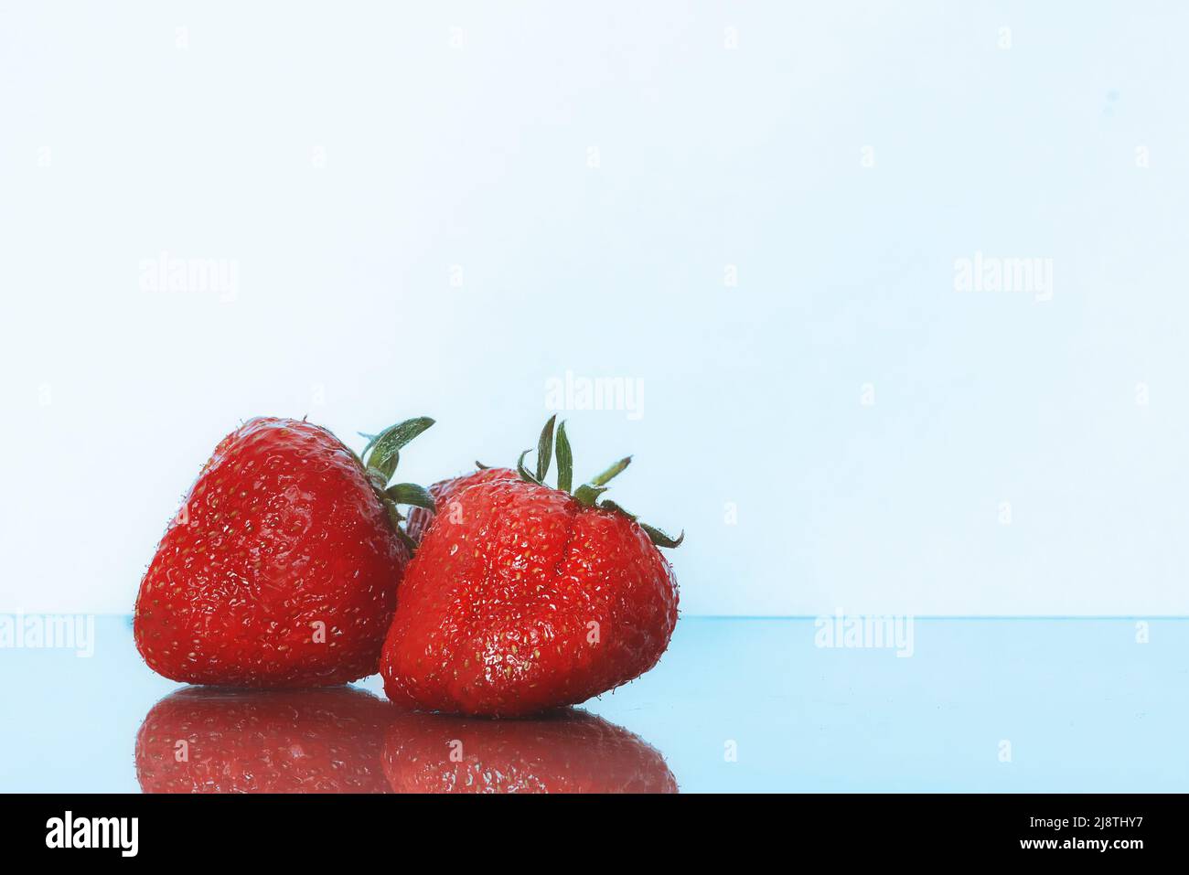 Strawberries isolated. Strawberry with leaf isolate. Two whole ...