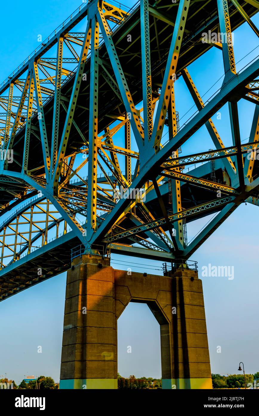 Blue Water Bridge with concrete support and clear blue sky from beneath ...