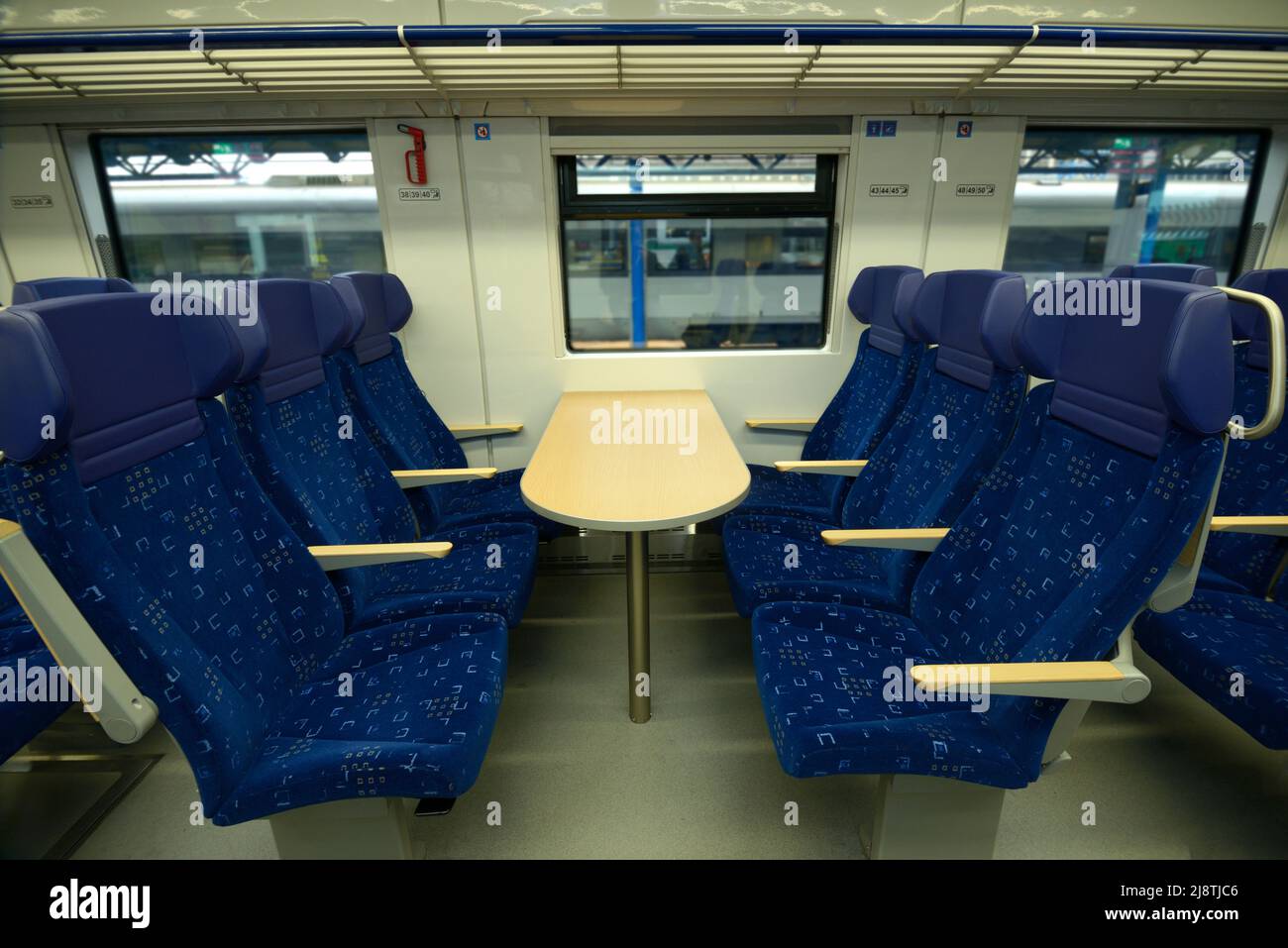 Empty 2 class compartment of the wagon of commuter train, seats Stock ...