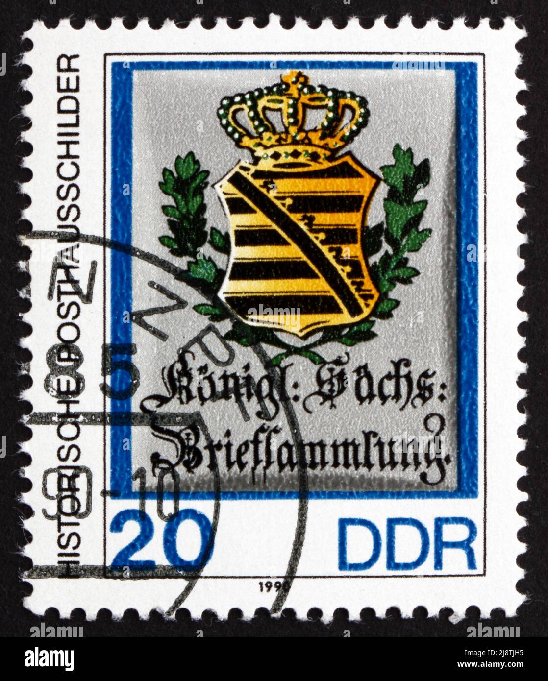 GDR - CIRCA 1990: a stamp printed in GDR shows Coat of Arms of Royal ...