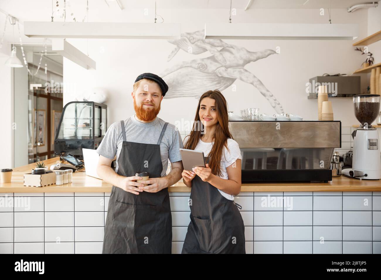 Coffee Business Concept - happy young bartender baristas ready to give ...