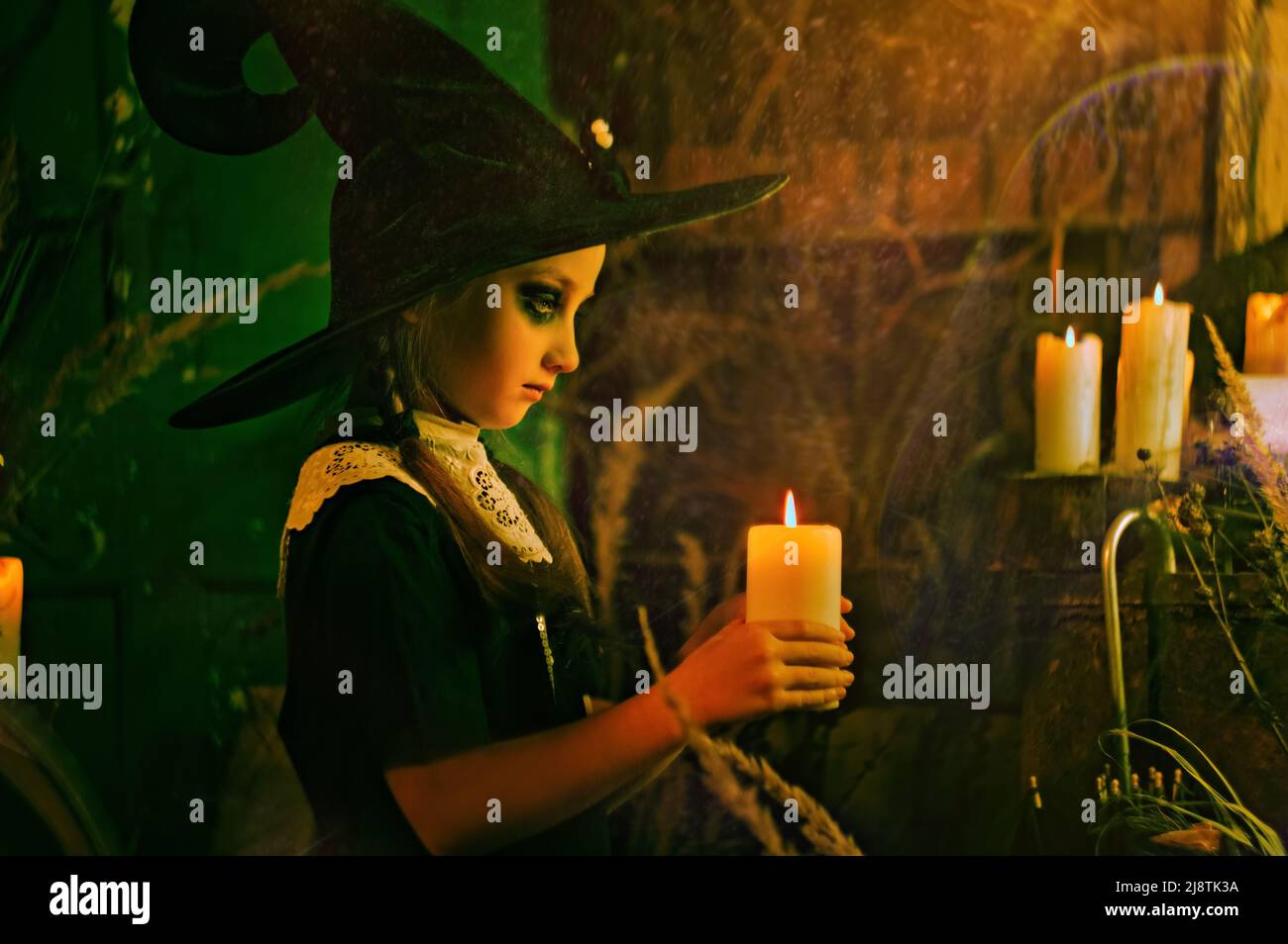 fairy tale portrait of a little girl in a big hat on her head ...