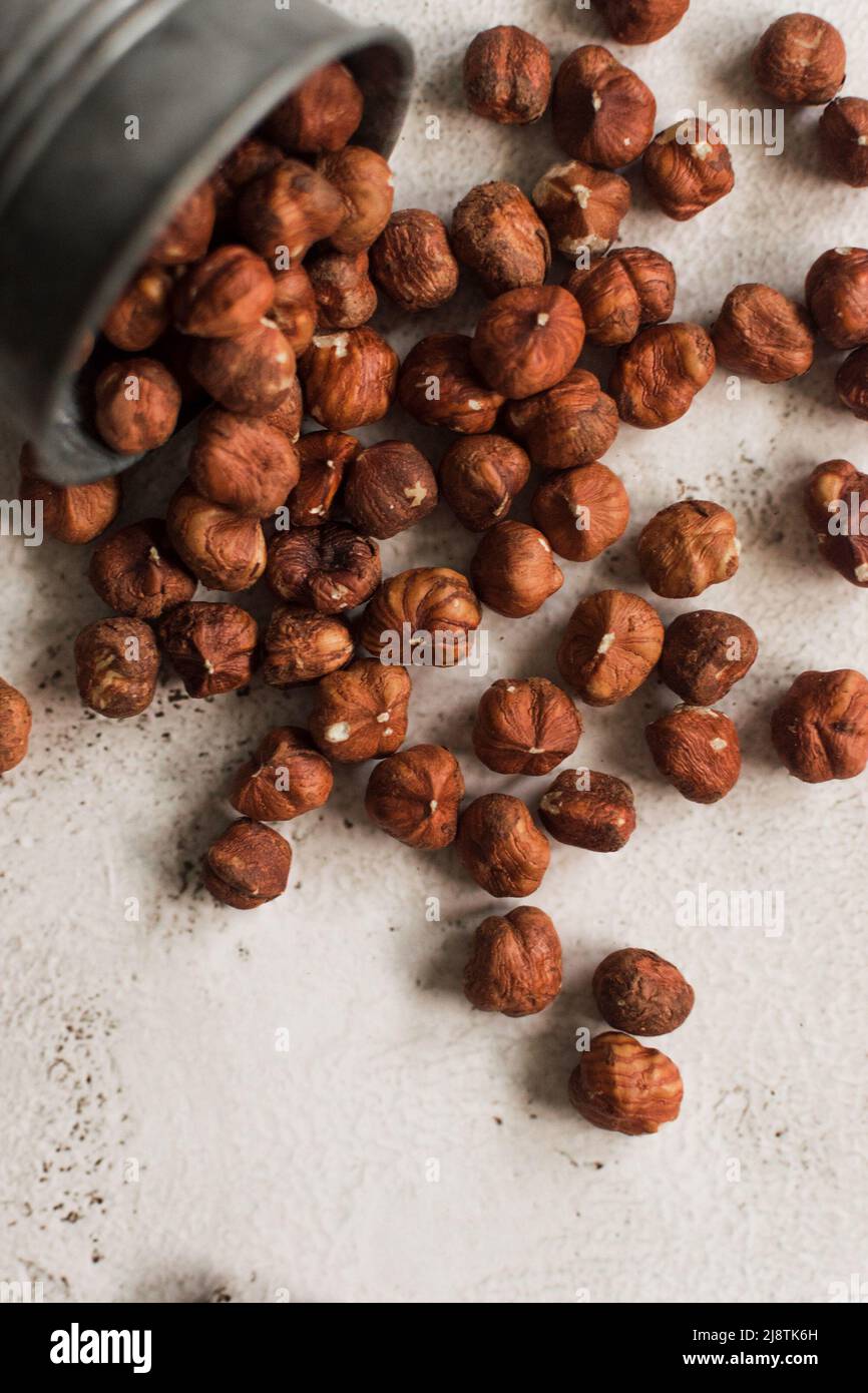 Pile of raw hazelnut on white background Stock Photo - Alamy