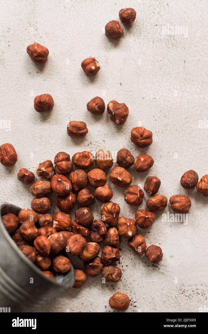 Pile of raw hazelnut on white background Stock Photo - Alamy
