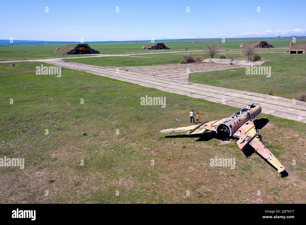 Tourist looking at the Russian Military plane wreckage on Big Shiraki ...