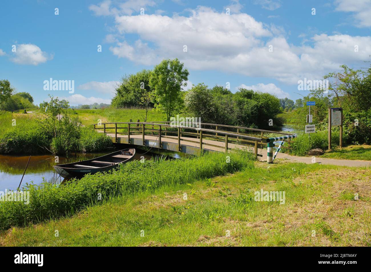 Beautiful dutch rural landscape, cycle track along river maas over old ...