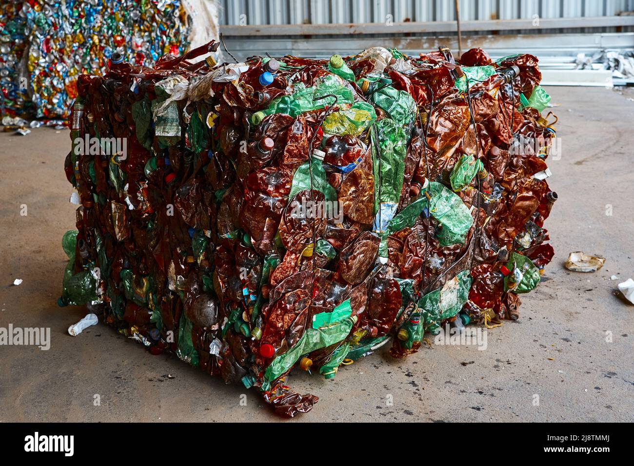 Block of pressed plastic bottles at litter processing plant Stock Photo ...