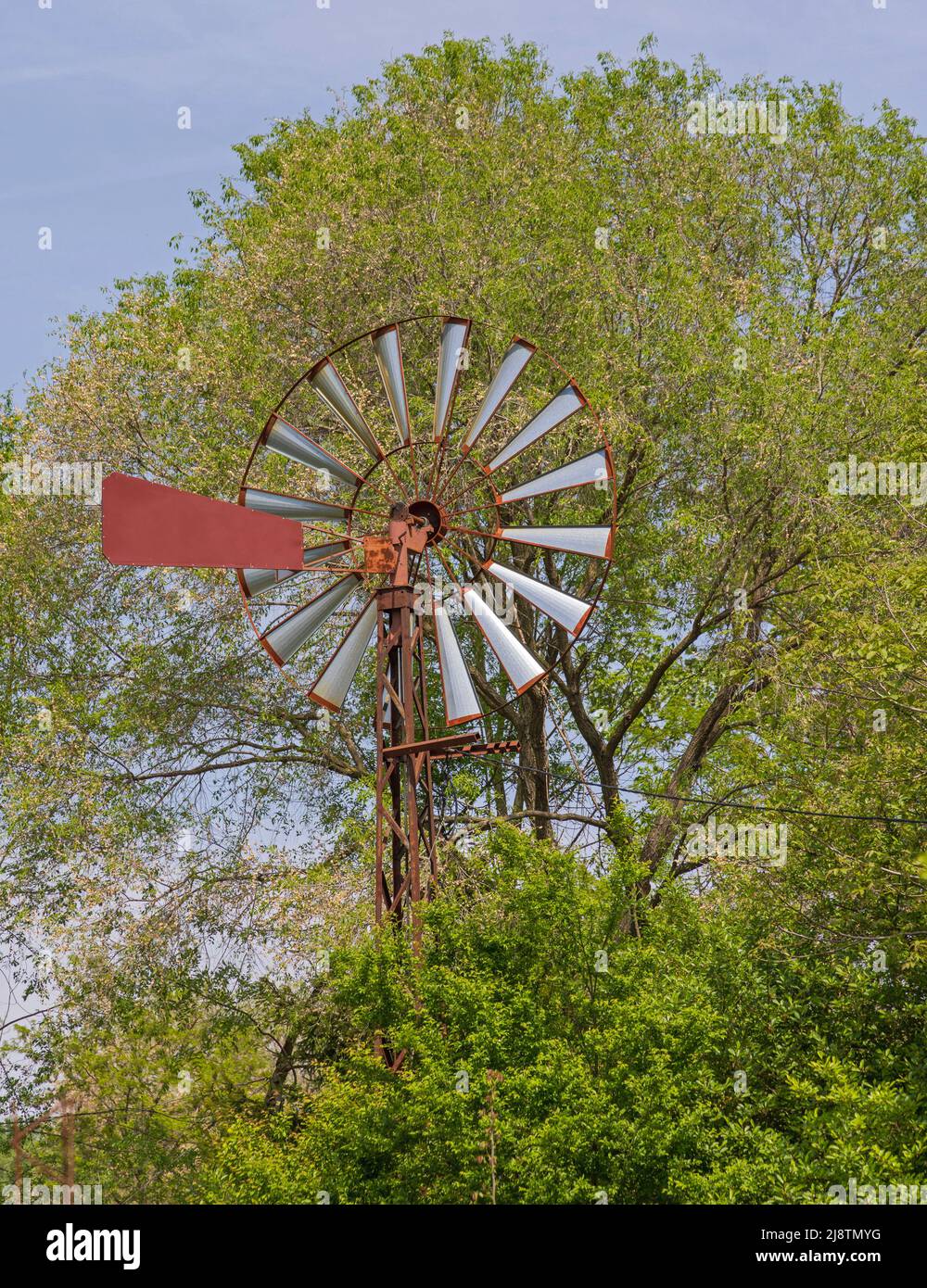 Rusty Old Style Wind Turbine Near Tree Farm Stock Photo - Alamy