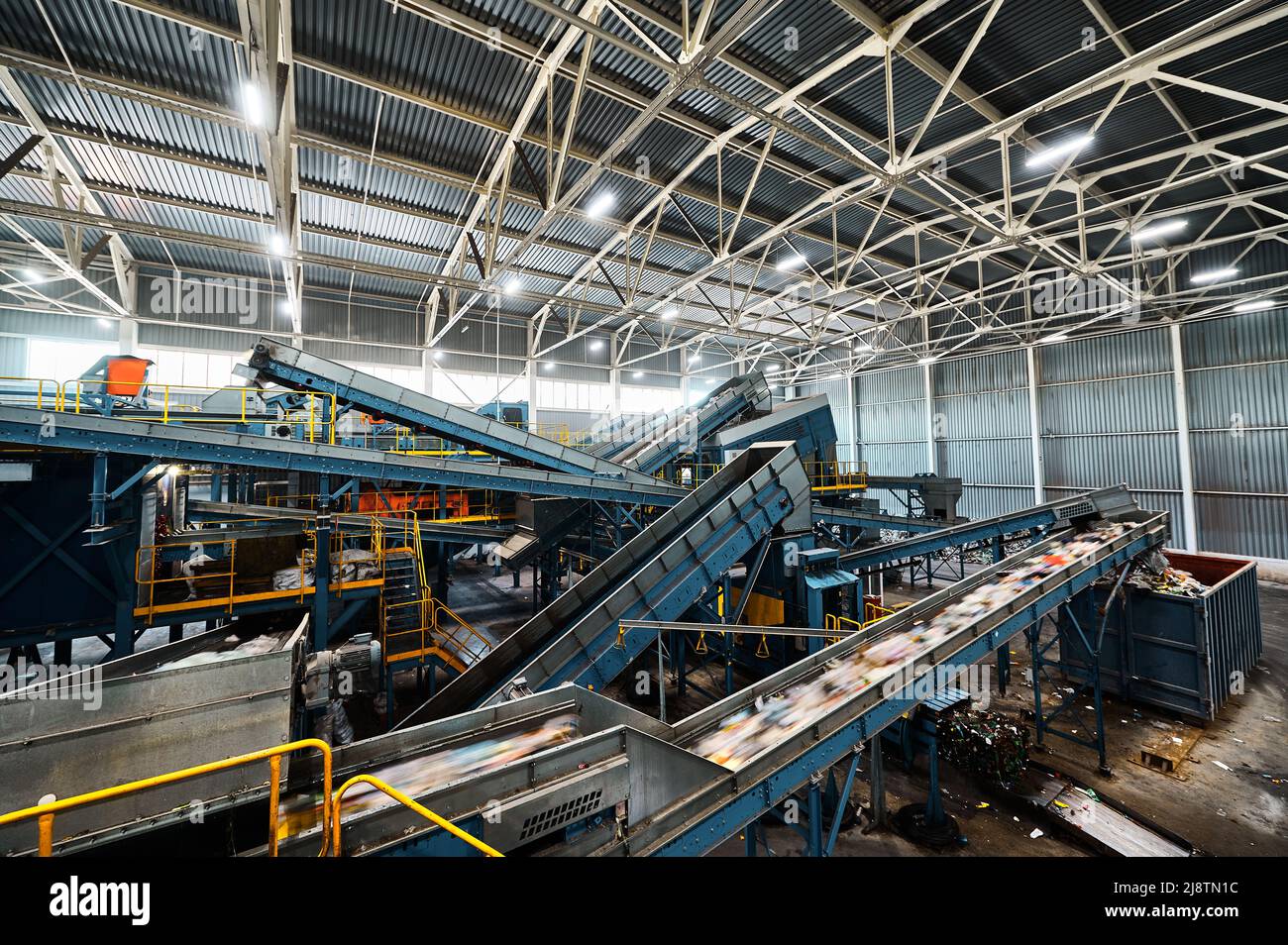 Large production line with conveyors carrying trash at plant Stock ...