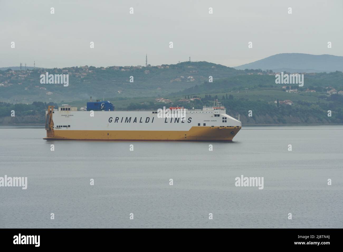 Big White and yellow Ro-Ro vessel or car carrier from shipping company ...