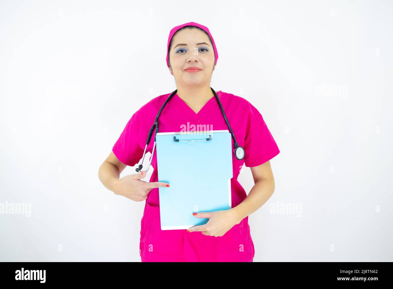 beautiful woman medical assistant, wearing uniform and pink surgical ...