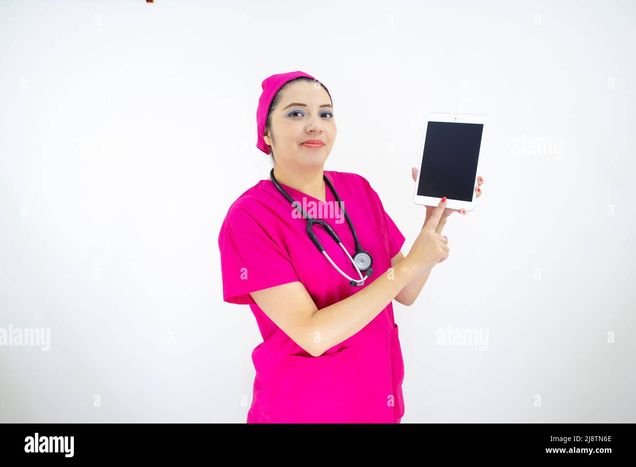 beautiful woman medical assistant, wearing pink uniform and pink ...