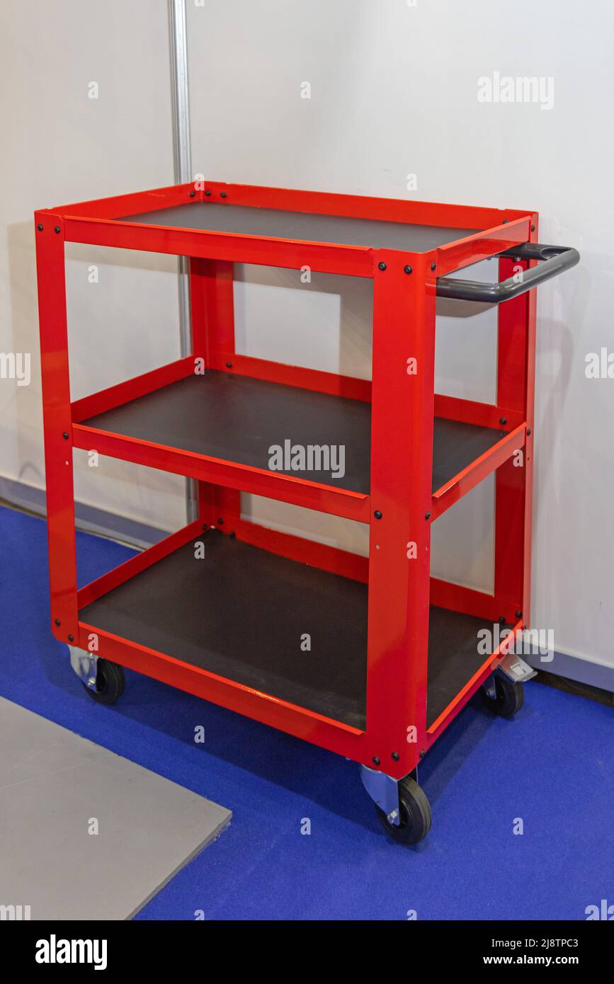 Multi Purpose Roller Cabinet With Three Shelves Stock Photo - Alamy