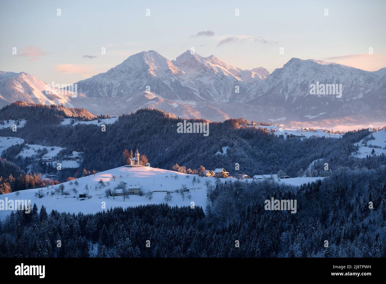 Beautiful winter morning after fresh snow with vivid sunrise colors ...