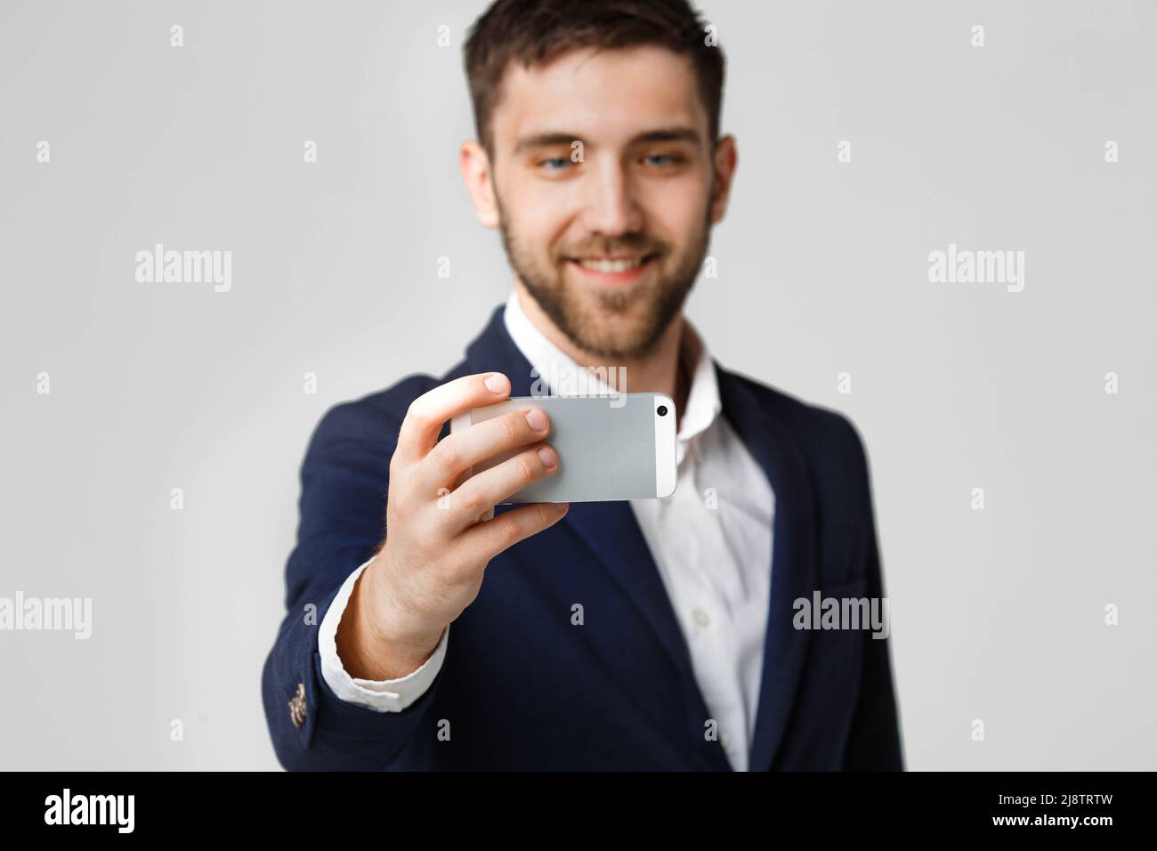 Business Concept - Handsome Business man take a selfie of himself with ... Business Concept - Handsome Business man take a selfie of himself with ...