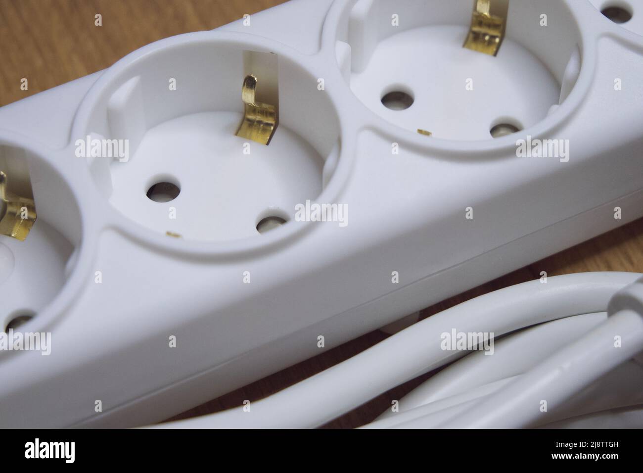 Tee for European plug. White extension cord, close-up shot Stock Photo ...