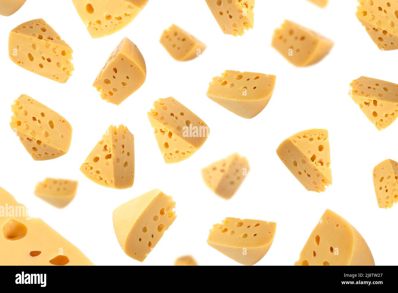 Falling cheese, isolated on white background, selective focus. Maasdam ...