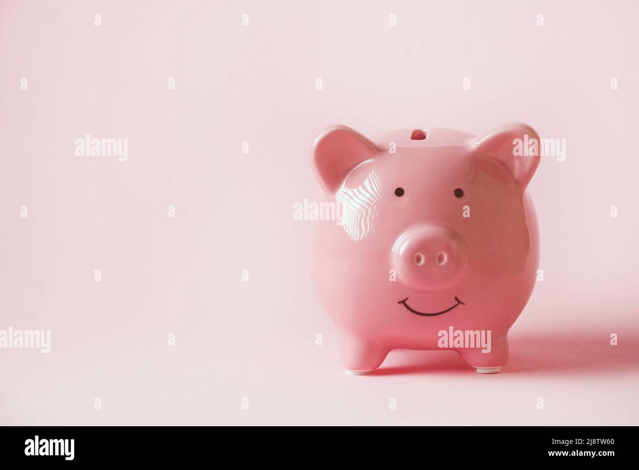 Cute pink piggy bank, close up view Stock Photo - Alamy
