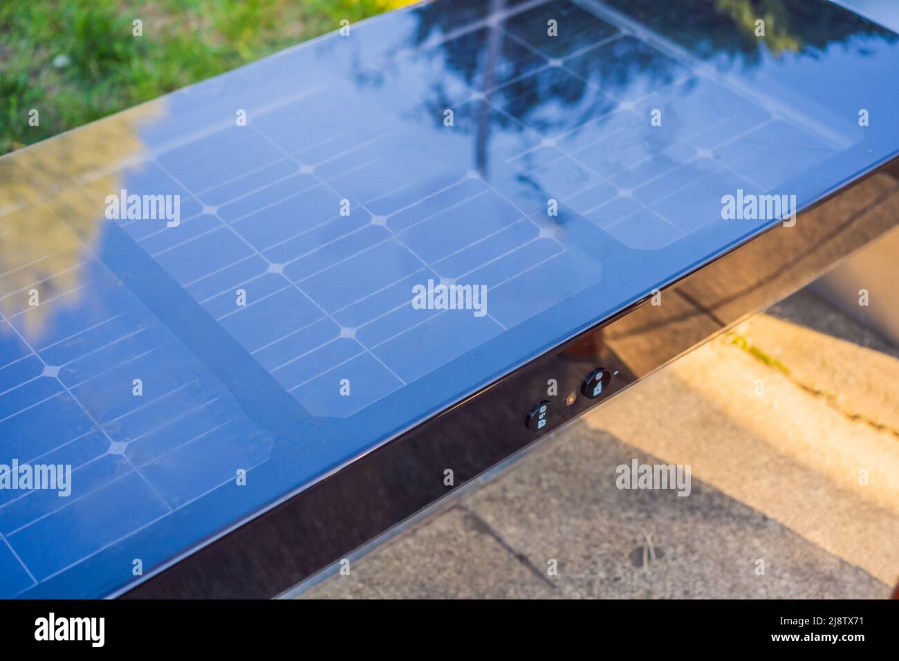 New smart bench in local public park used for charging mobile phones ...