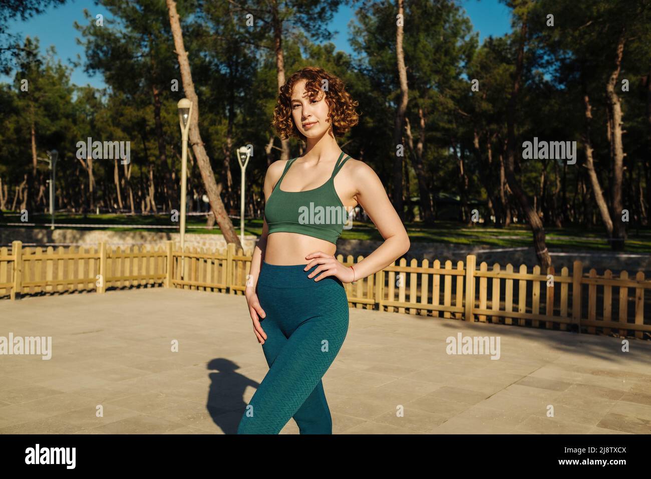 Beautiful fitness model girl posing wearing sport clothes. Girl in the ...