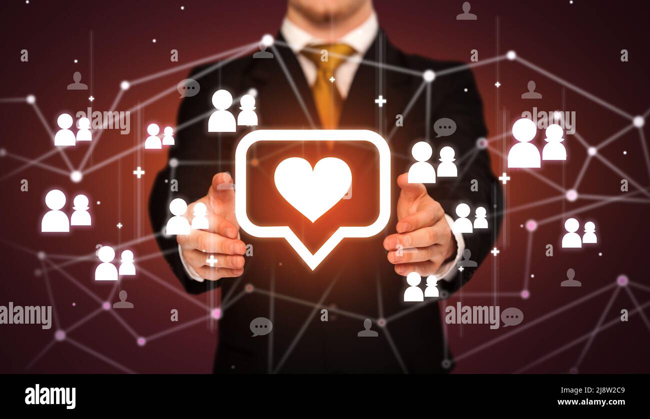 Hand holding social media icons Stock Photo - Alamy
