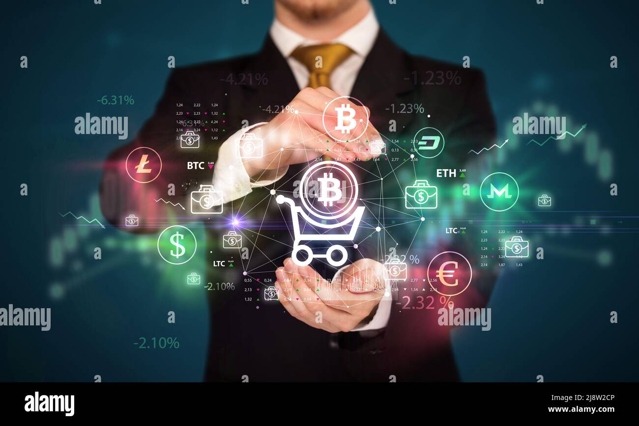 Businessman holding currency symbols concept Stock Photo - Alamy