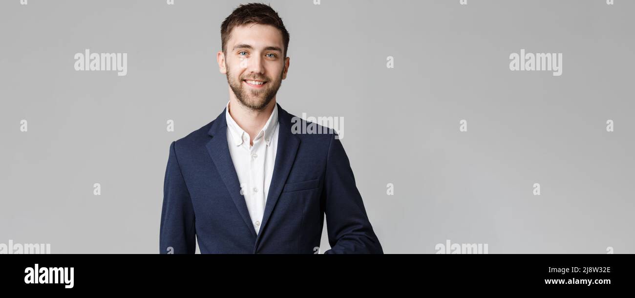 Business Concept - Young successful businessman posing over dark ... Business Concept - Young successful businessman posing over dark ...