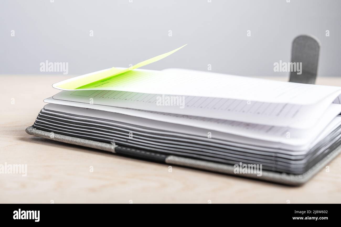 Sticky note in planner, notebook. Memo records. Writing important ...