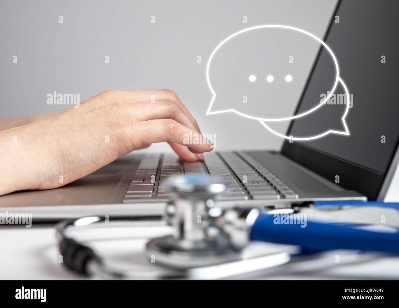 Online medical consultation. Doctor using laptop for chatting with ...